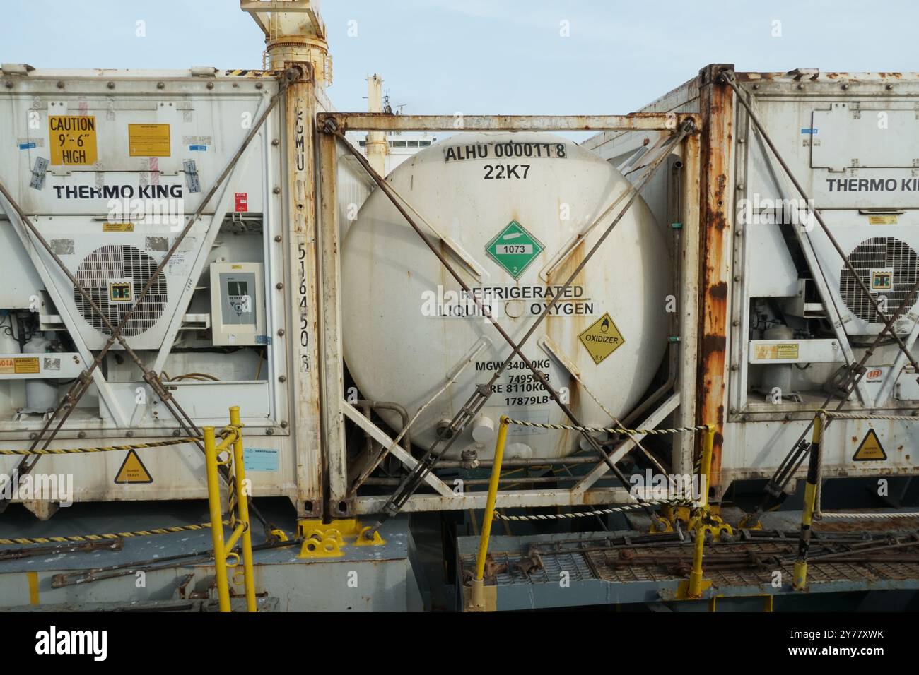 DG container and two reefers lashed with bars and twist locks on deck ...