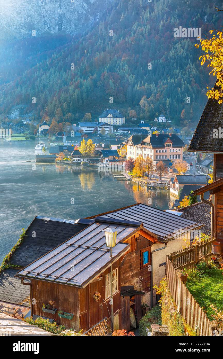 Amazing foggy autumn sunrise on famous Hallstatt mountain village with Hallstatter lake. Popular ...