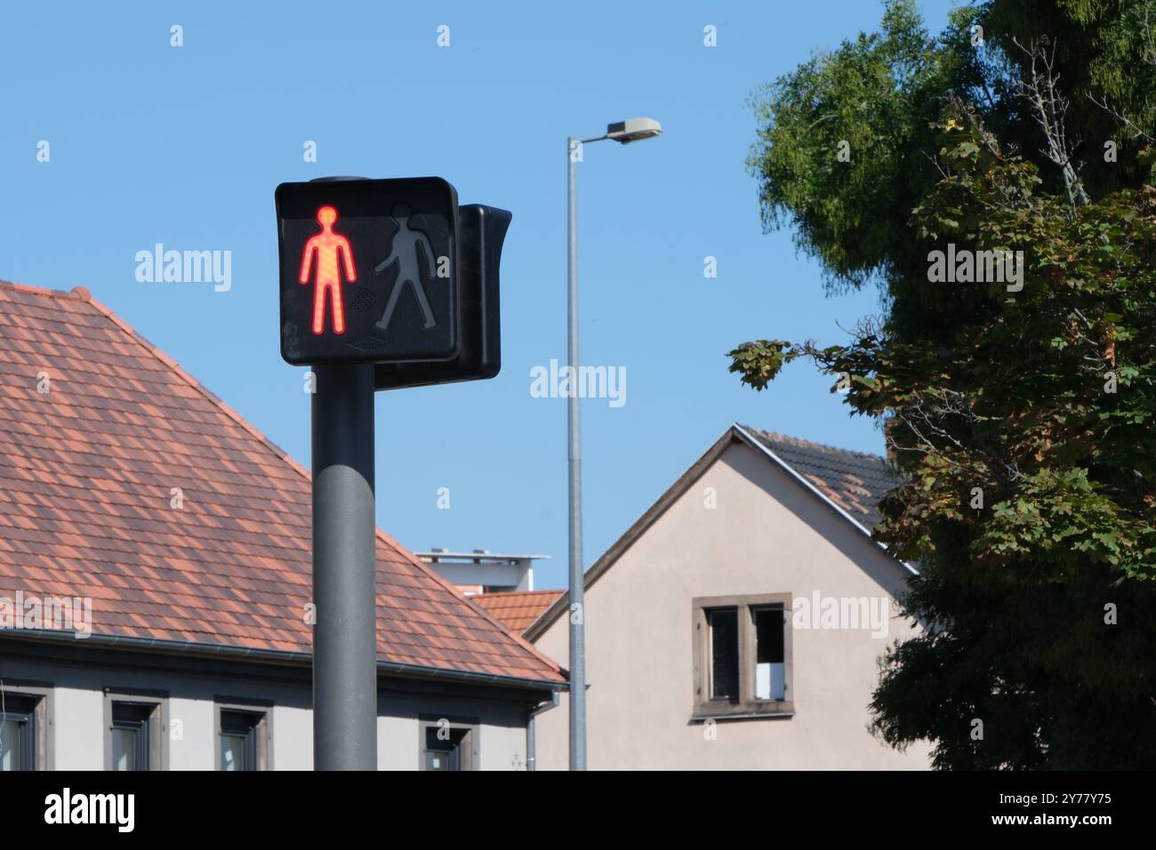 Pedestrian semaphore traffic light with red stop signal in shape of man ...