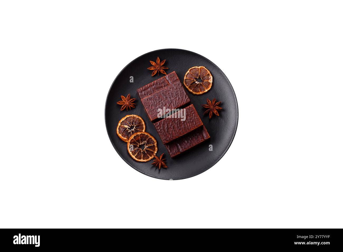 Rectangular chocolate candies with mousse and waffles on a white ...