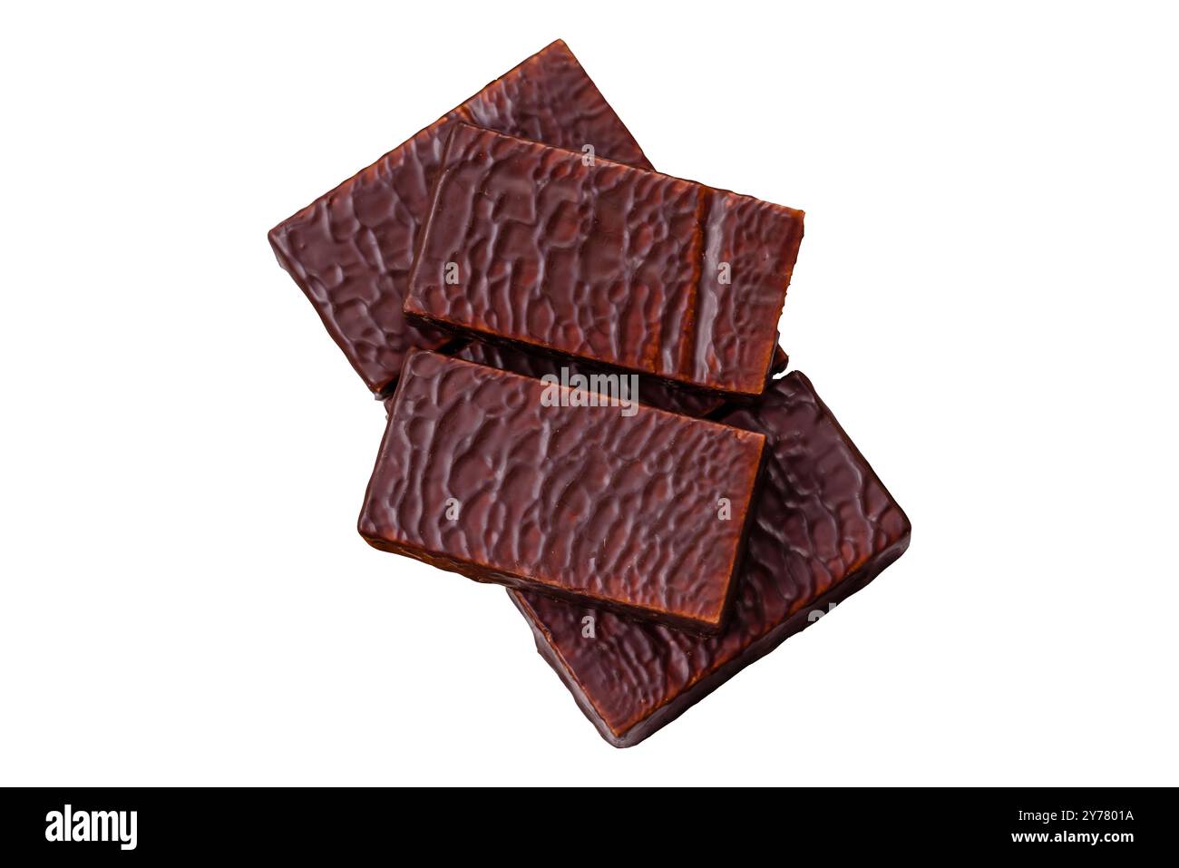 Rectangular chocolate candies with mousse and waffles on a white ...