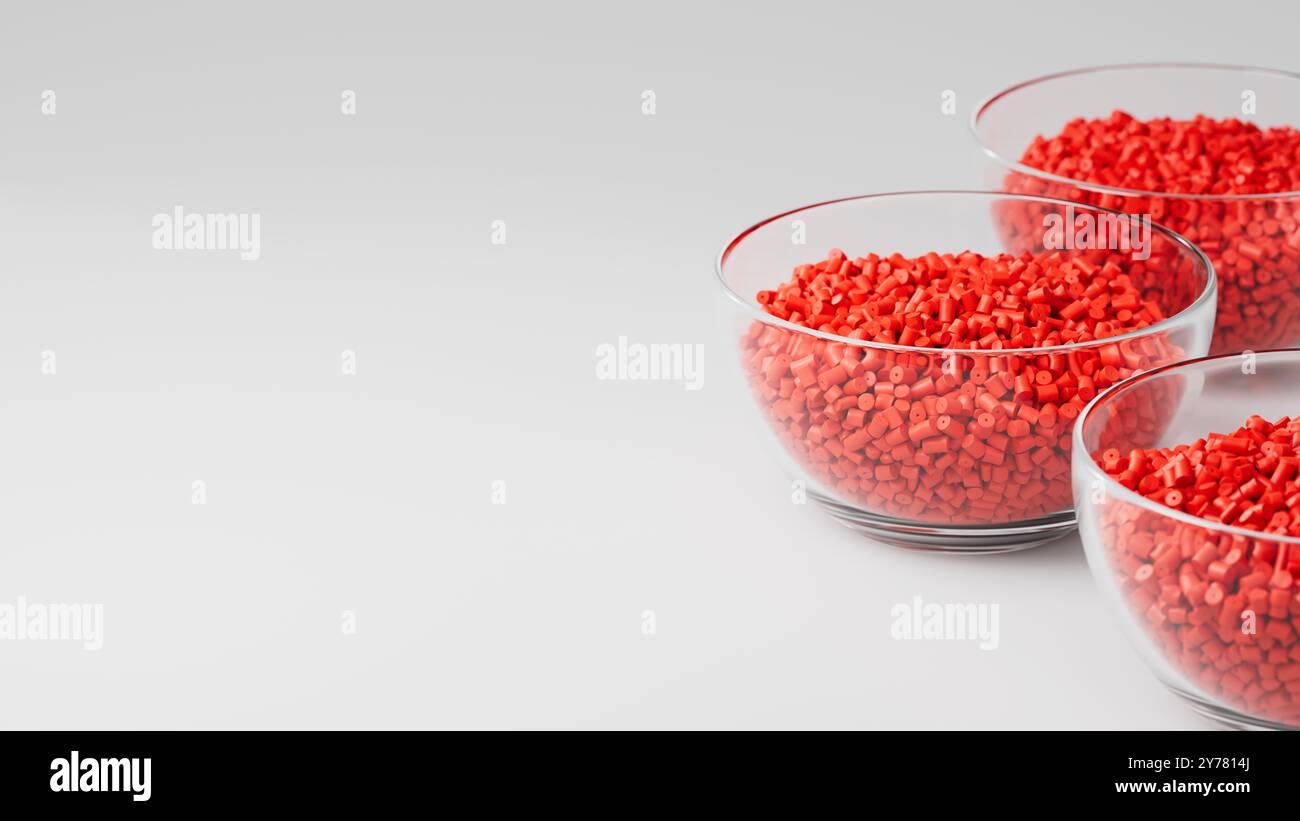 Glass cups with red plastic polypropylene granules, masterbatch polymer ...