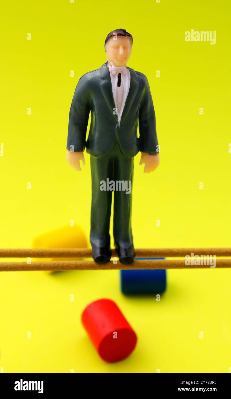 Executive on top overcoming obstacles Stock Photo - Alamy