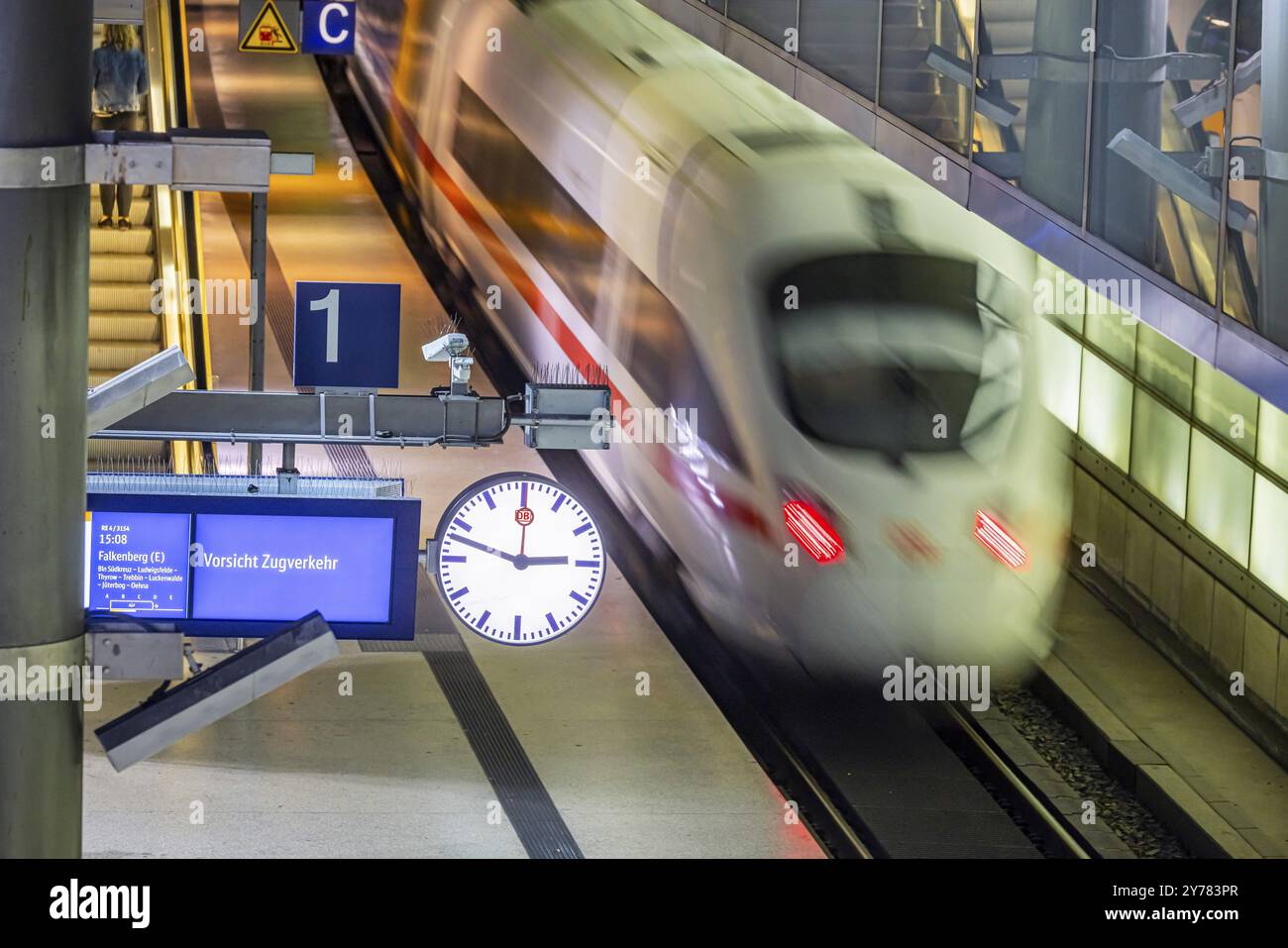 Platform at Gesundbrunnen station with an ICE train passing through ...