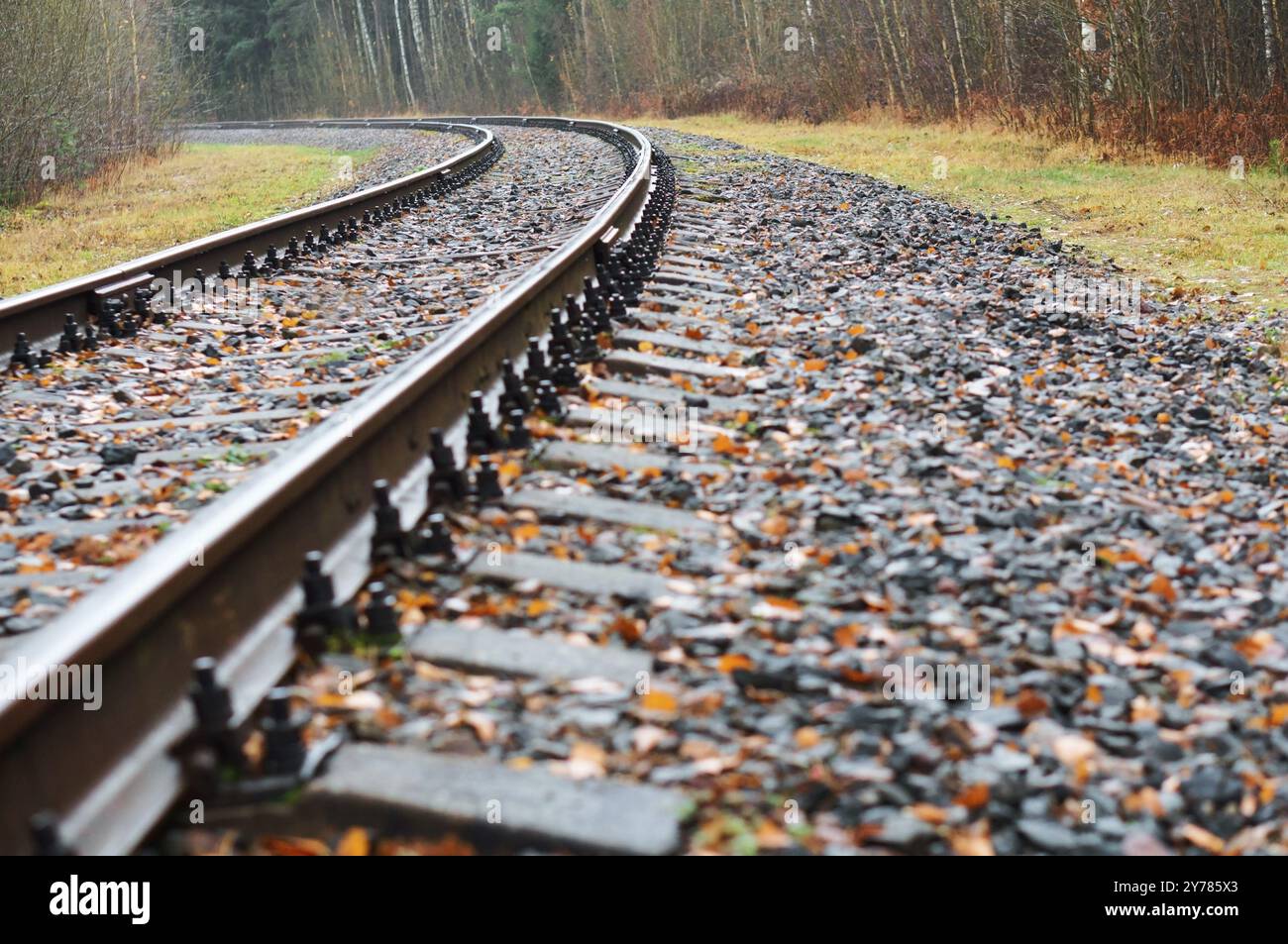 Railway tracks and sleepers, railway rails turn Stock Photo - Alamy