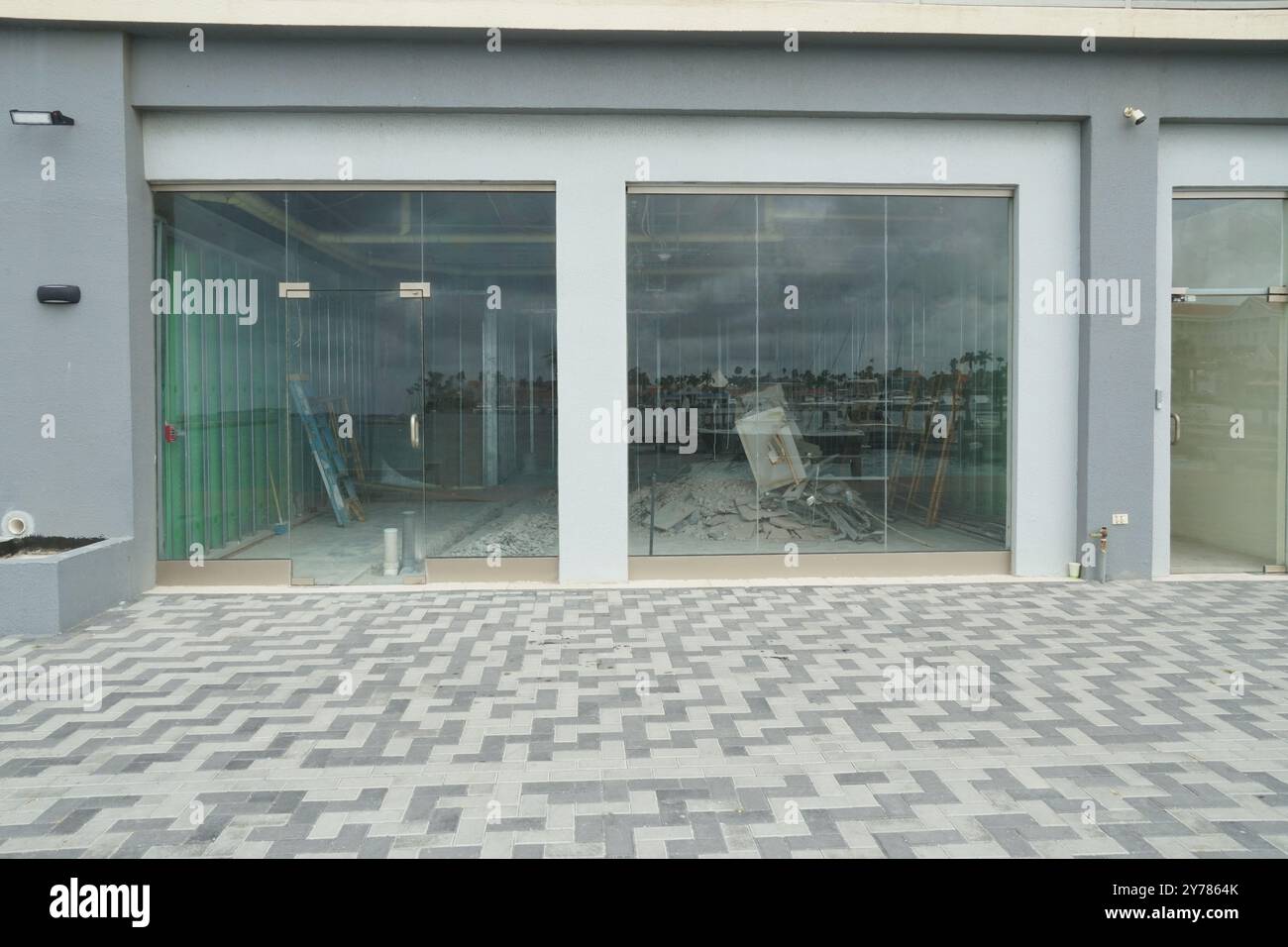 A shop or restaurant with expansive glass windows is currently ...