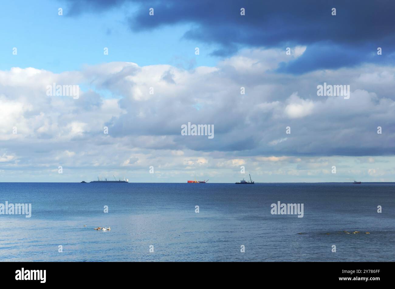 Green sea waves, three ships on the horizon, Baltic sea Stock Photo - Alamy
