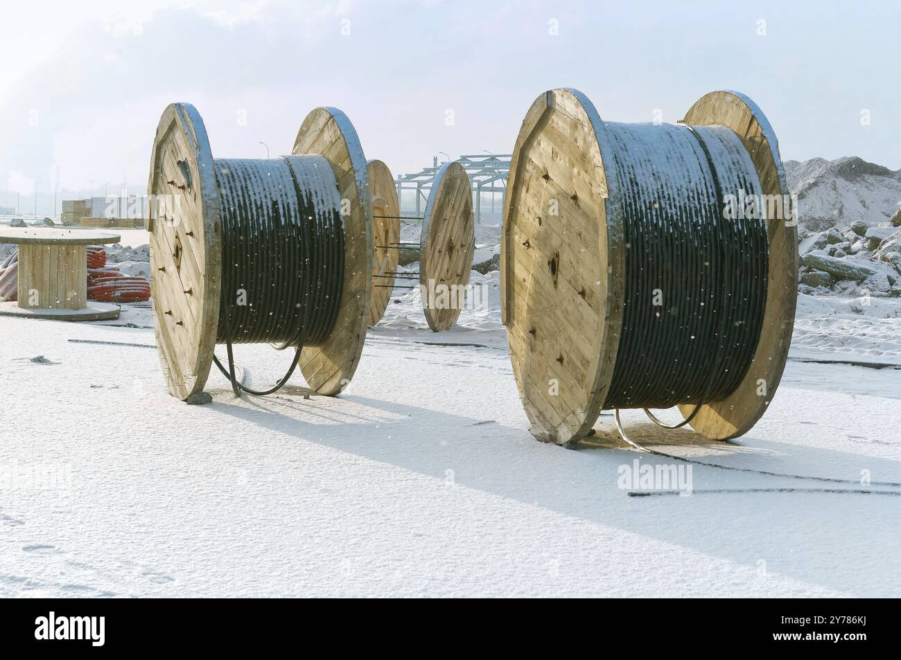 Coils with electric cable, wooden bobbin for cable winding Stock Photo ...