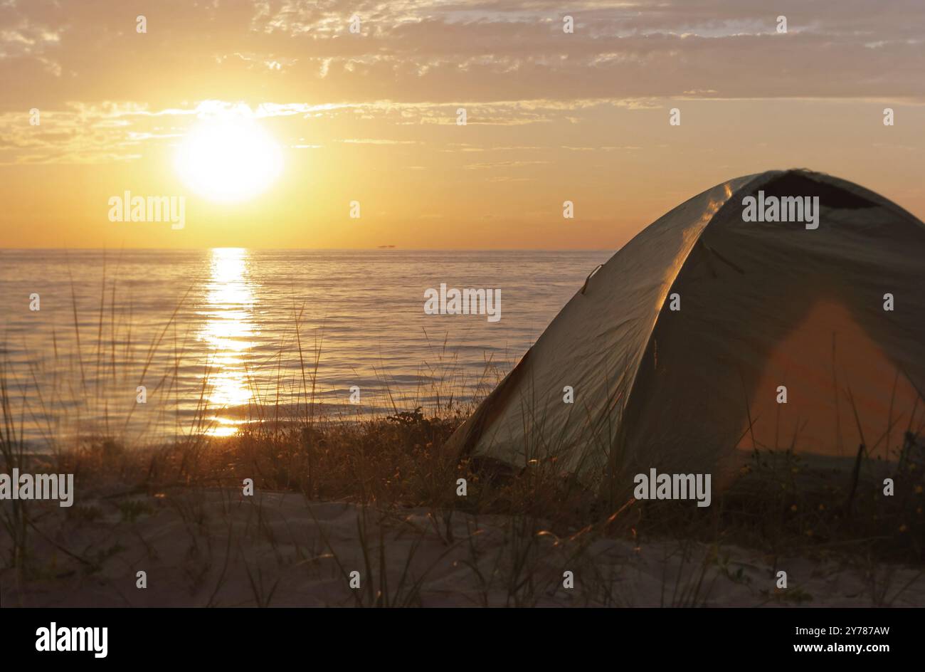 Tourist tent on the beach, camping at sunset on the sea Stock Photo - Alamy