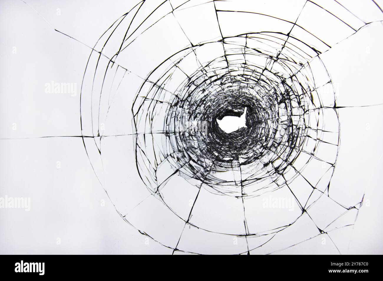 Broken transparent glass on the door window, a hole in the damaged ...