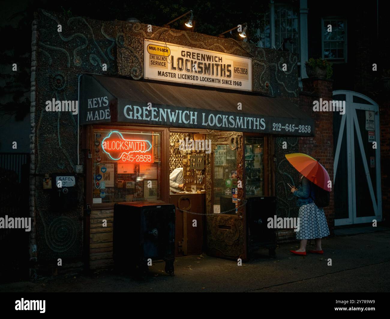 Greenwich Locksmiths storefront at night in the West Village, Manhattan ...