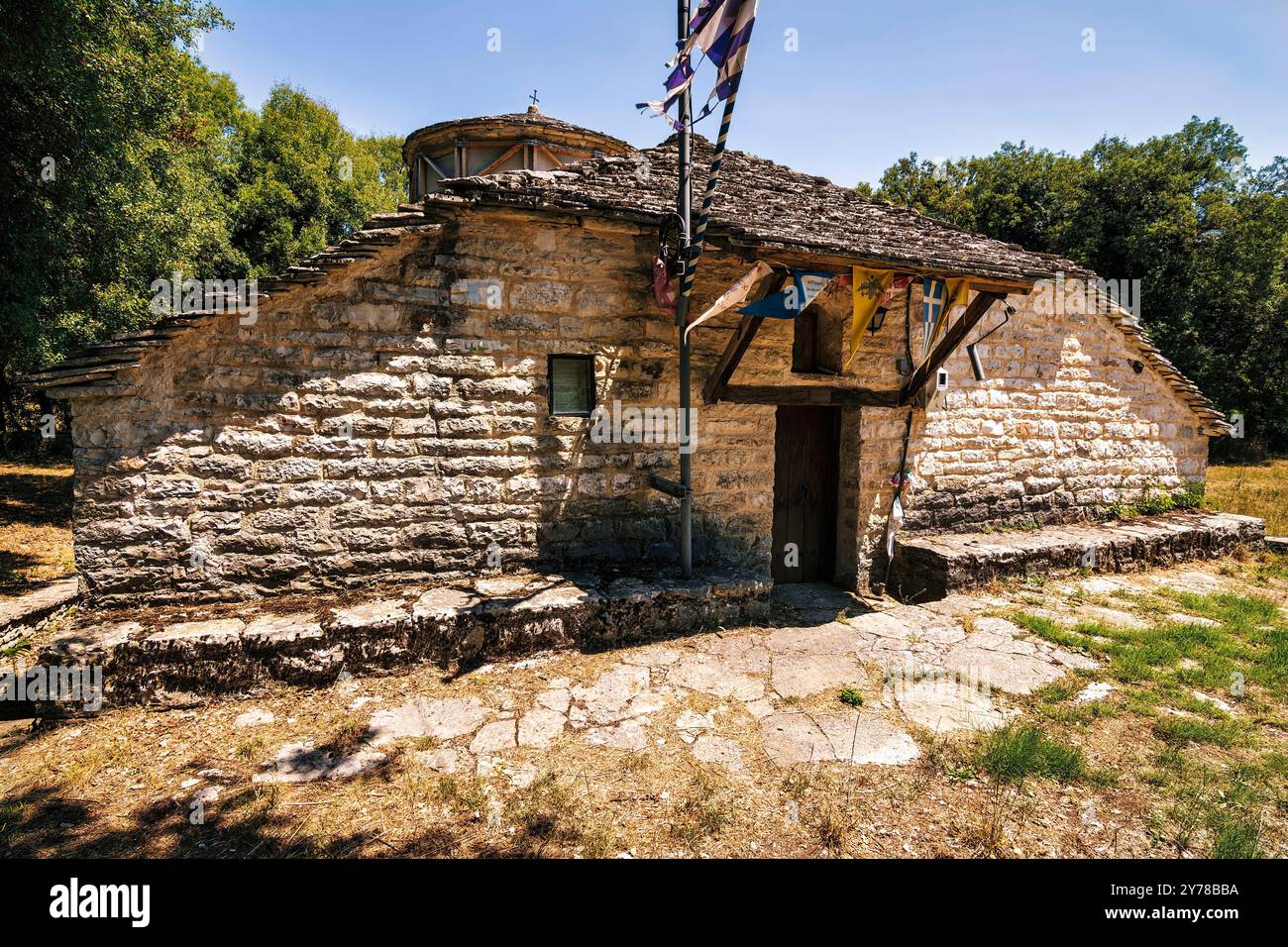 Stone facade of the Old Taxiarches Church in Kato Pedina, Zagori ...