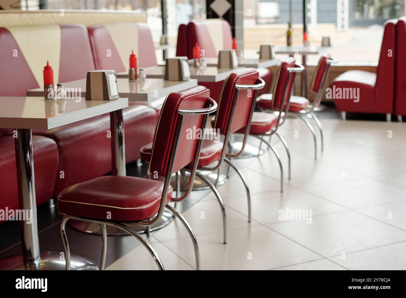 Red leather seats and silver accents in classic 1950s diner creating ...