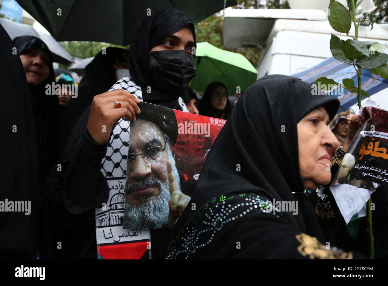Tehran, Iran. 28th Sep, 2024. An Iranian demonstrator holds a picture ...
