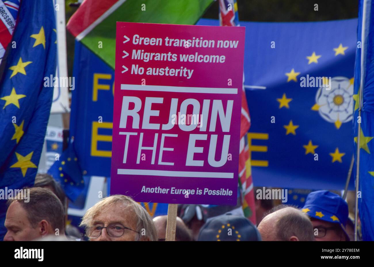 London, UK. 28th Sep, 2024. A protester holds a 'Rejoin the EU' placard ...