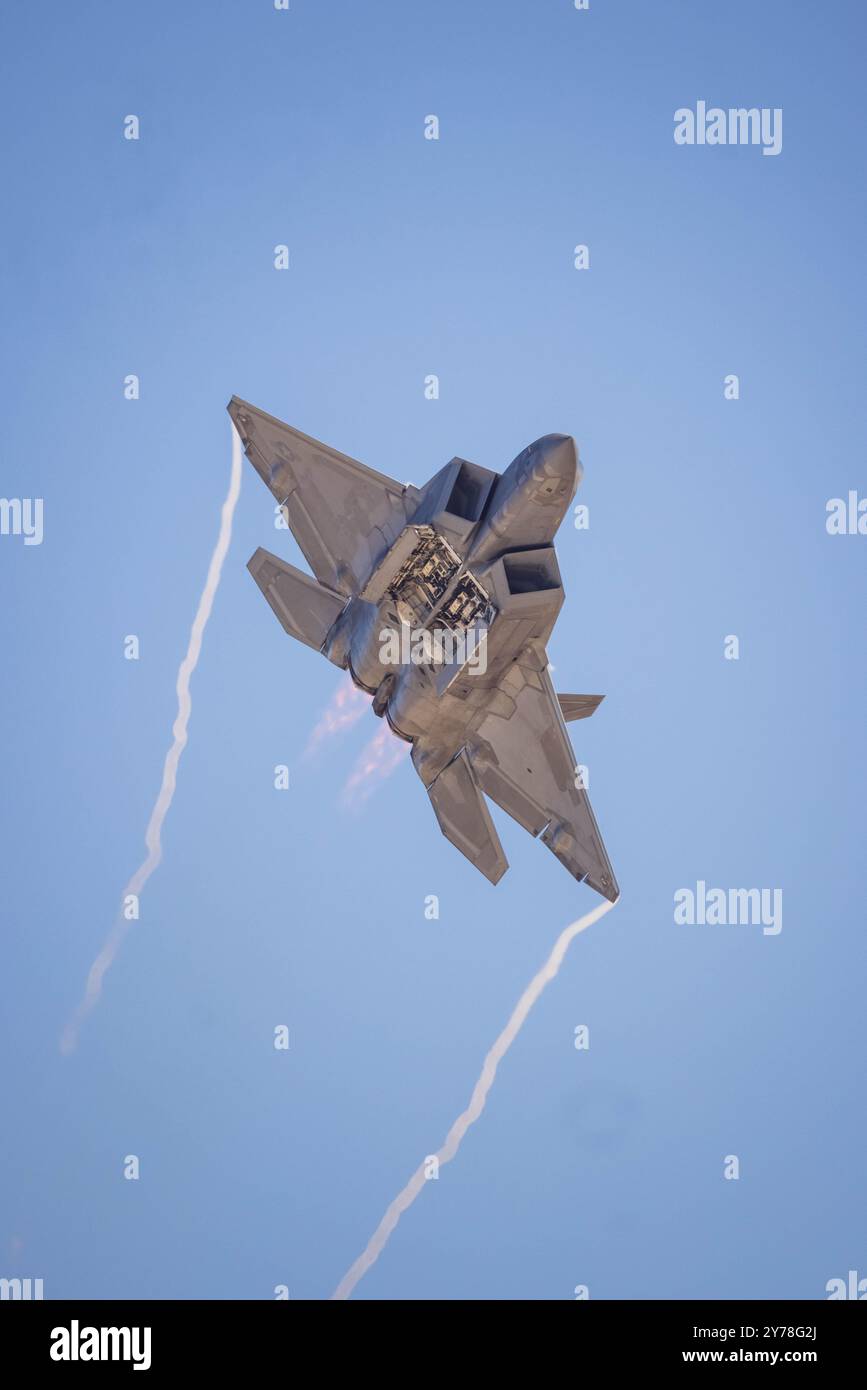 A U.S. Air Force F-22 Raptor performs aerobatic maneuvers during the ...