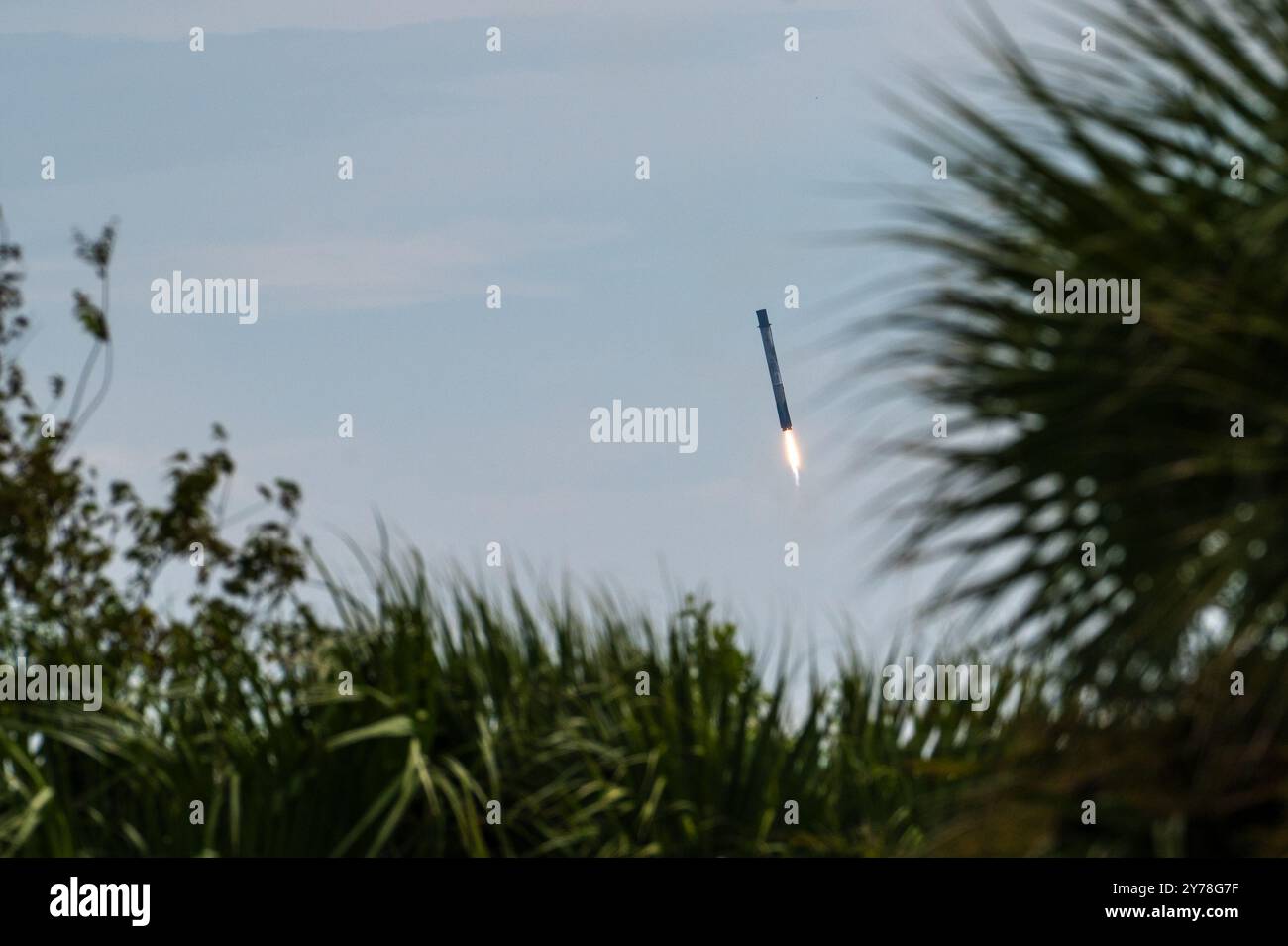 A SpaceX Falcon 9 booster returns from launch at Cape Canaveral Space ...