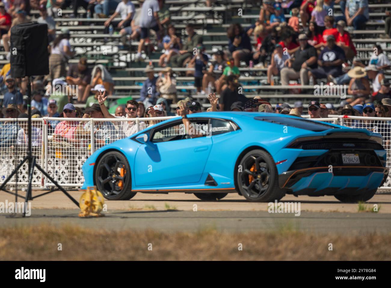 A driver with Precision Exotics drives off of the flight line after ...