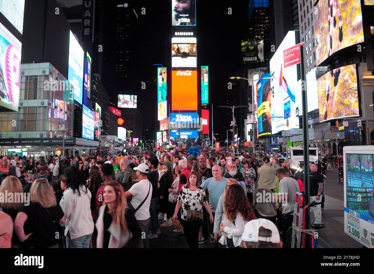 People walk through Times Square, Manhattan, New York City Stock Photo ...