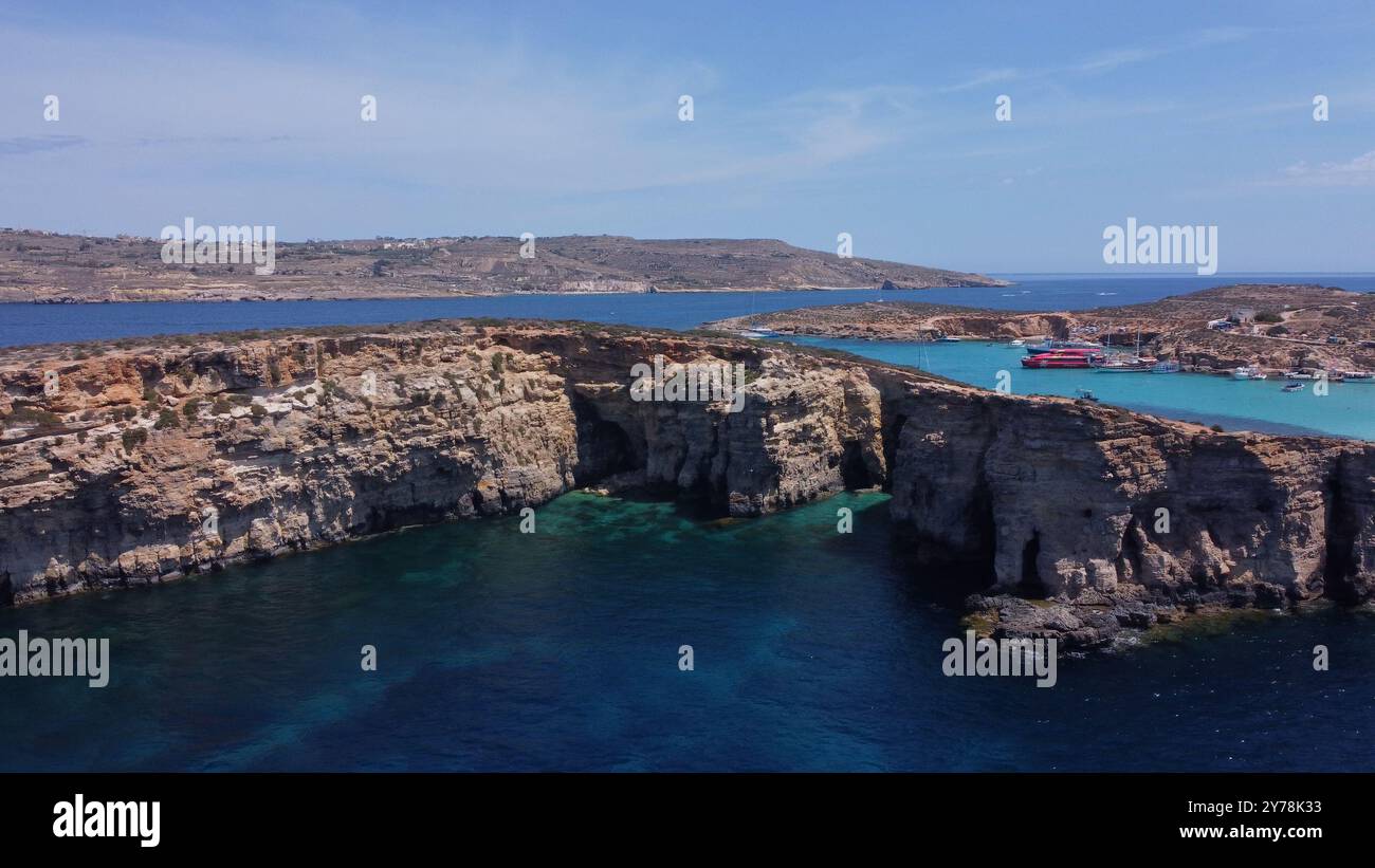 Aerial view of the sea caves of Cominotto uninhabited island near ...