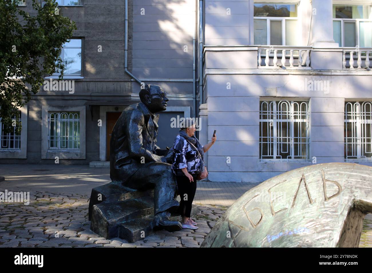 A woman takes a selfie near a monument to Russian writer Isaac Babel ...