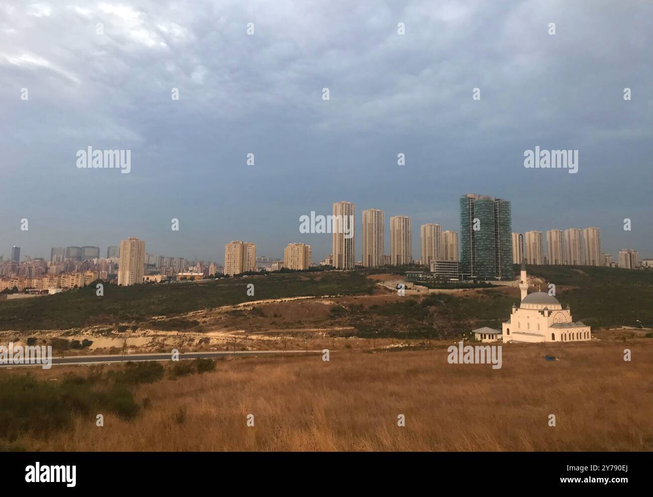 Mosque, skyscraper and public housing at in the barren land in Istanbul ...