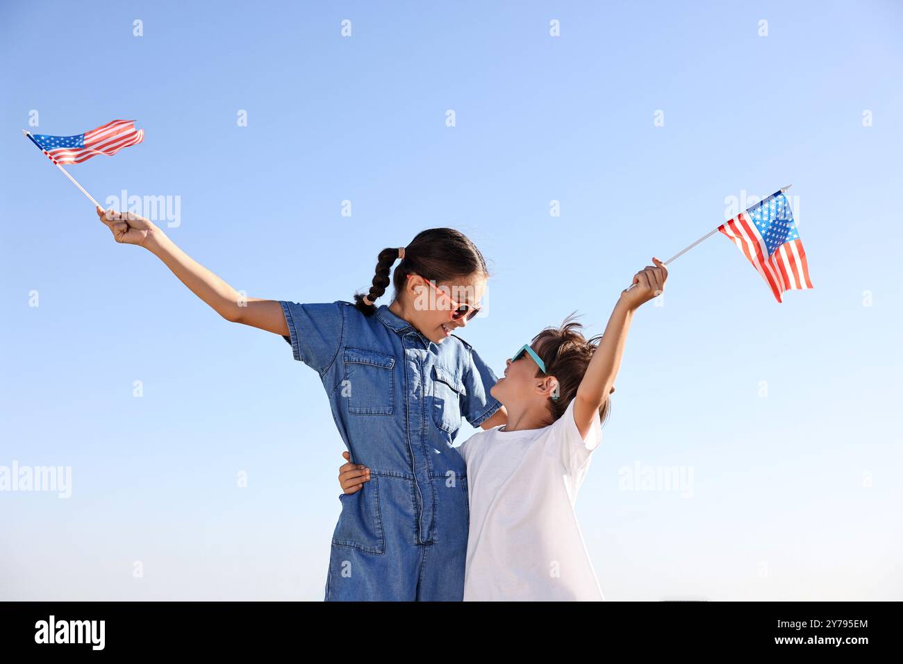 Brother and sister with flags of USA outdoors Stock Photo - Alamy