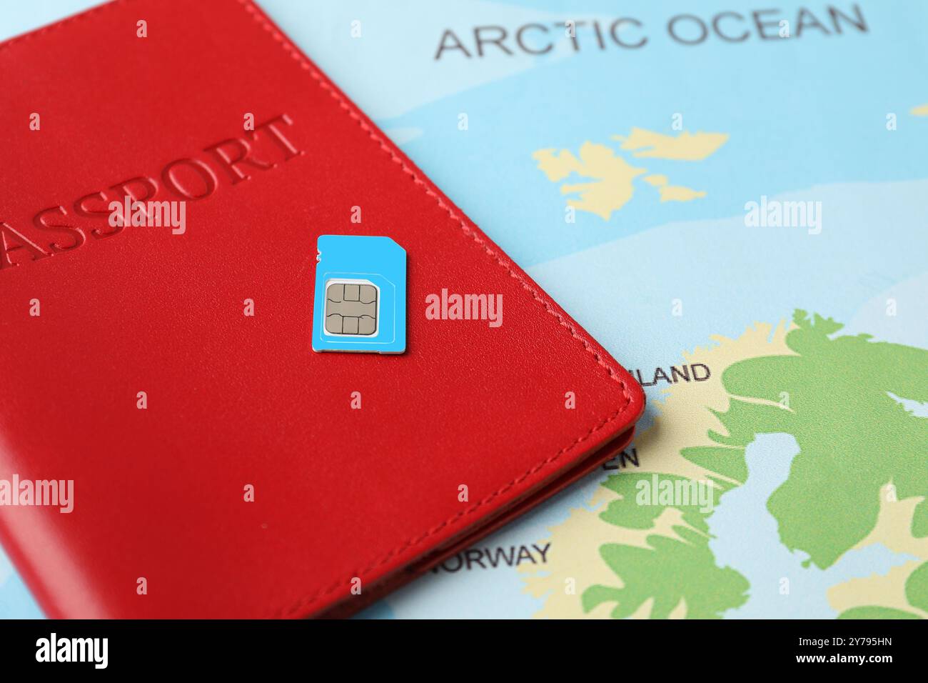 Passport and SIM card on world map, closeup Stock Photo - Alamy