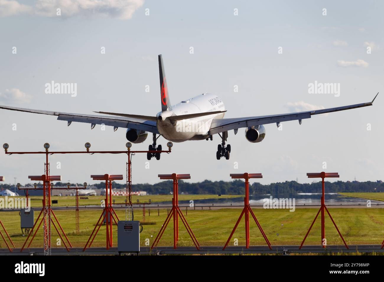 Air Canada passenger plane landing a the t Montréal-Pierre Elliott Trudeau International Airport ...