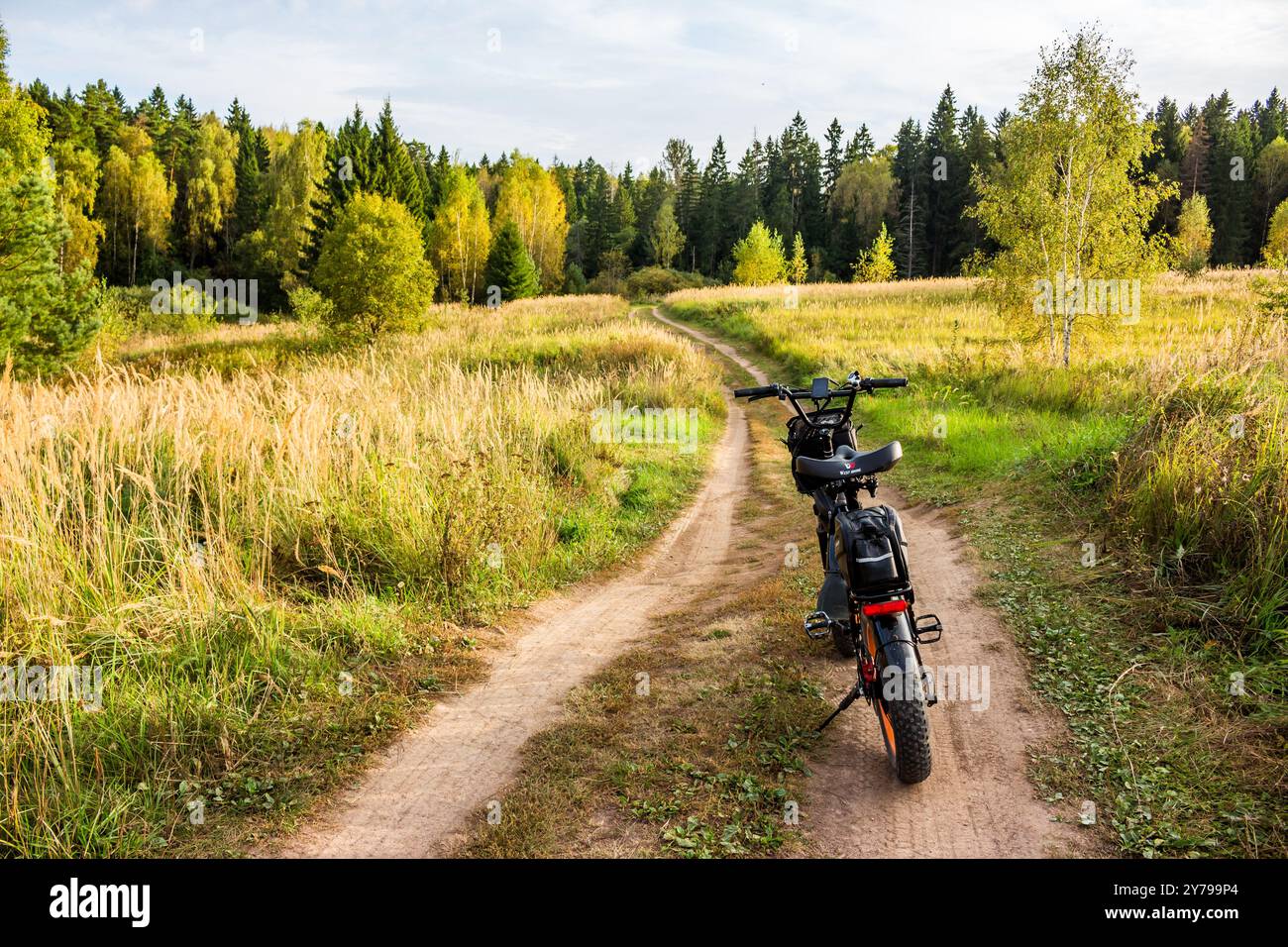 Electric bike ride along scenic nature routes, fatbike on country road ...