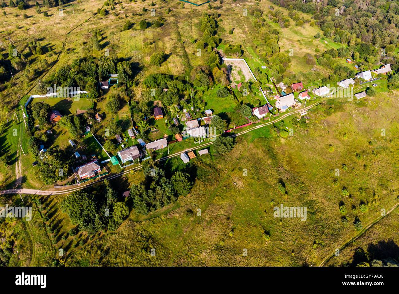 Aerial view of a small village with one street and houses in a row ...