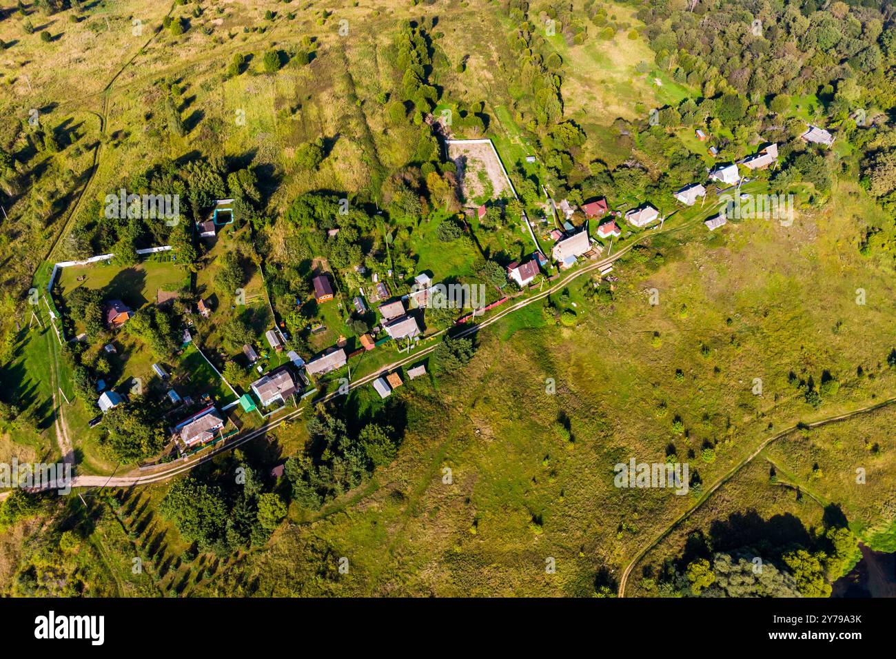 Aerial view of a small village with one street and houses in a row ...