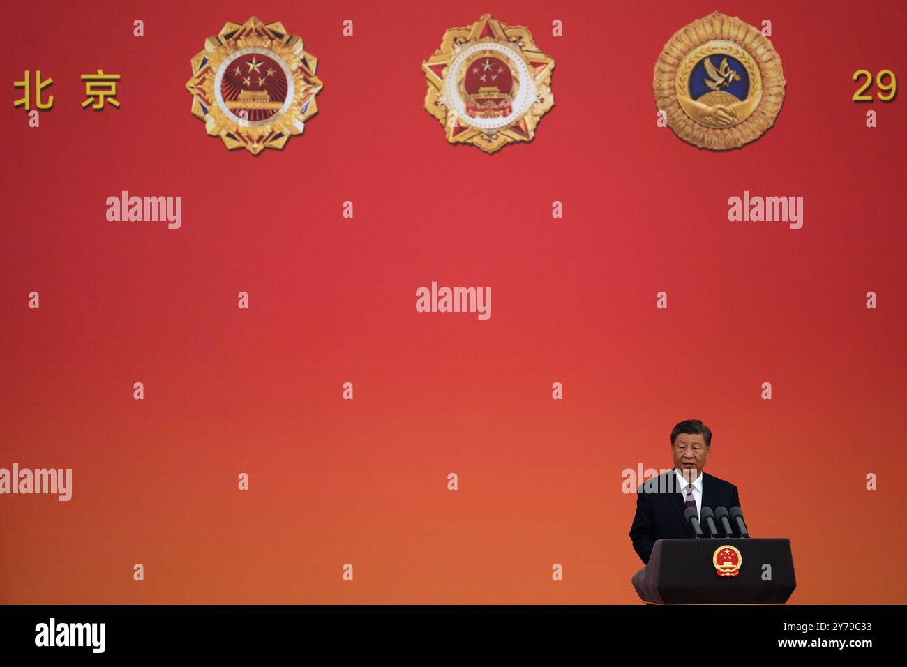 Chinese President Xi Jinping speaks after presenting national medals at ...