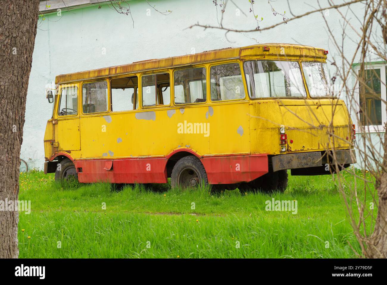 Yellow passenger bus. Old Soviet bus. Side view of the bus from the ...