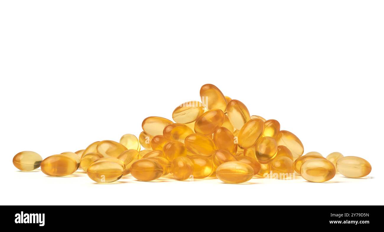 pile of fish oil capsules or pills isolated white background, dietary ...