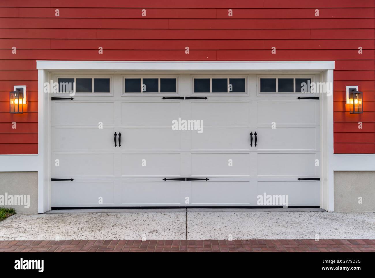 White electronic garage doors transom light windows on a double garage ...