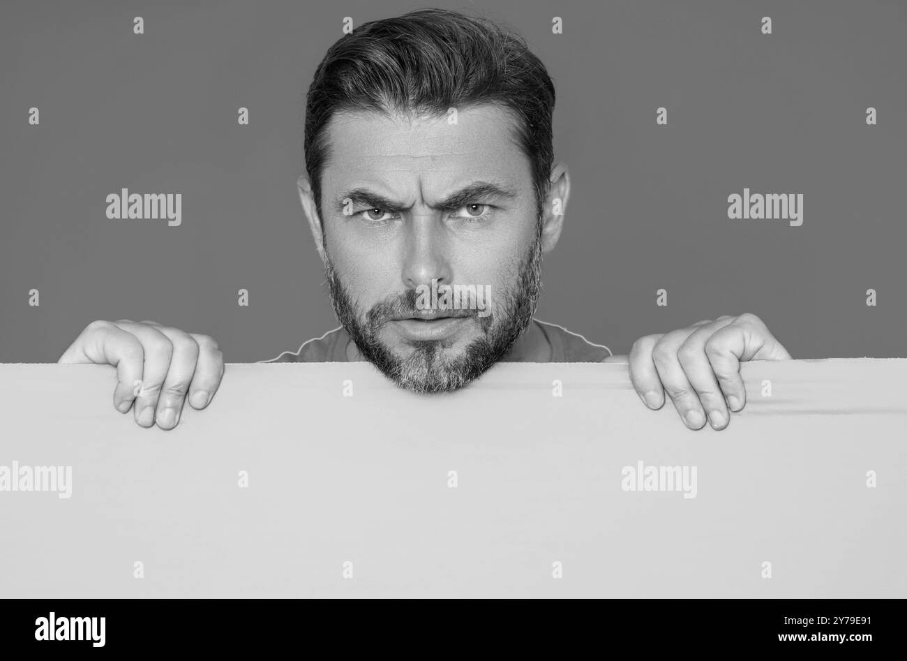 Information concept. Angry man with blank placard. Demonstrating copy ...