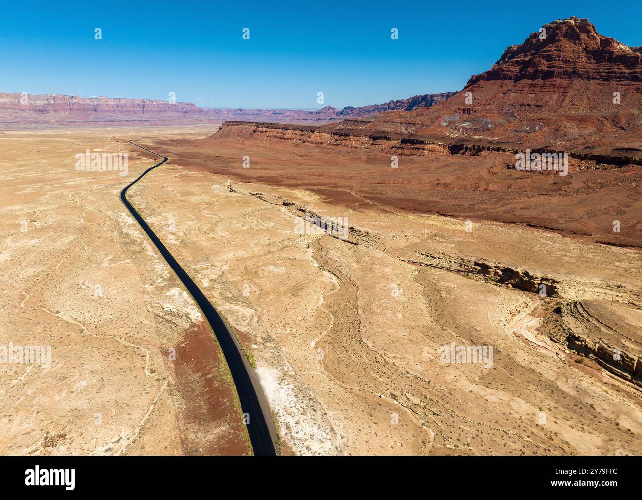 A highway cuts through the Vermilion Cliffs region of northern Arizona ...