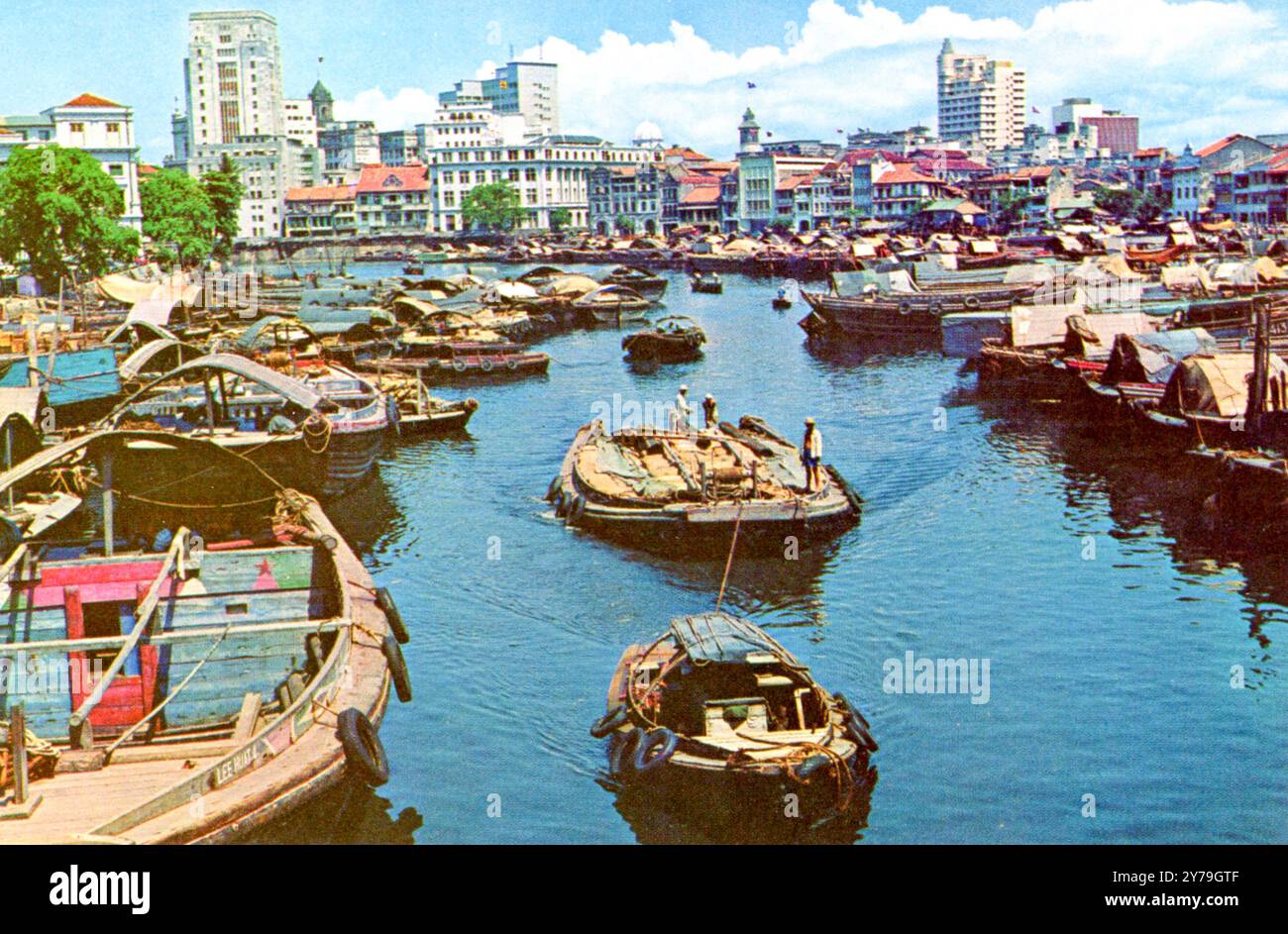 A 1960's postcard image of Singapore River showing sampan boats that ...