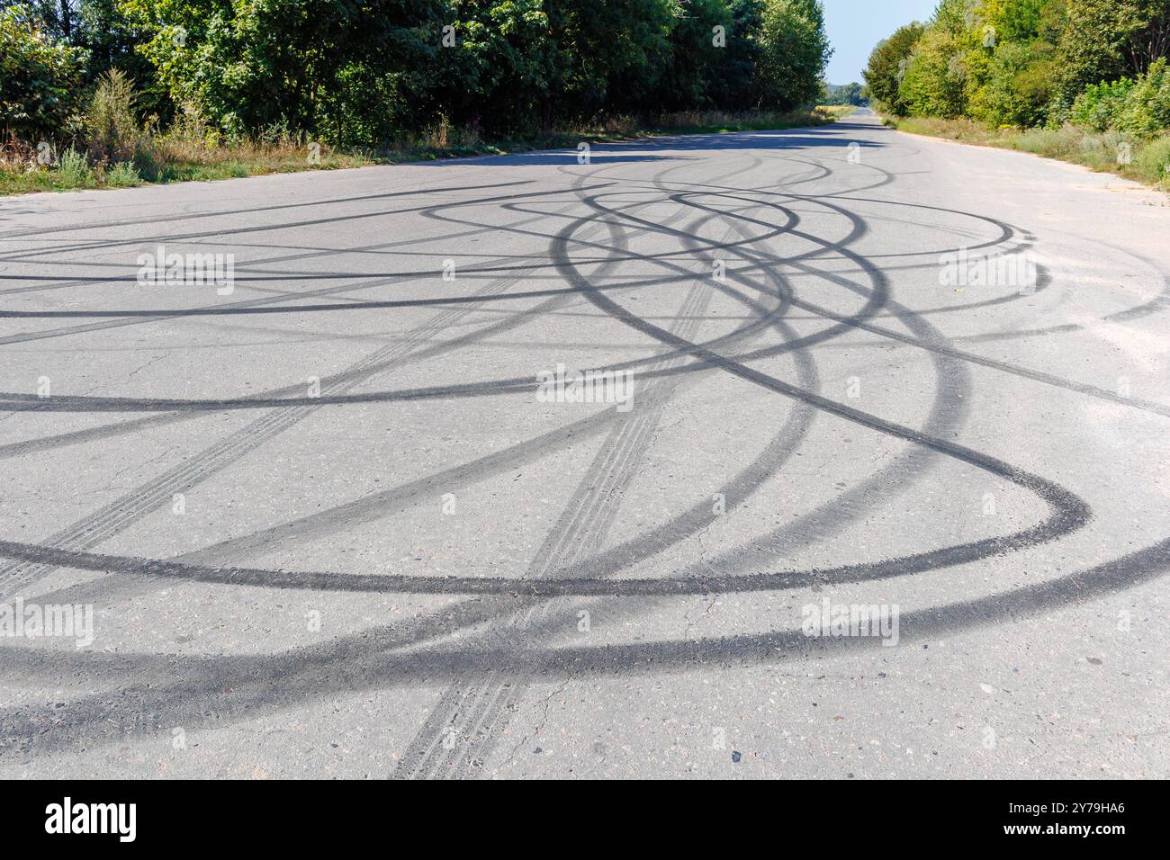 skid marks on a road surface. Circular tire marks left by drivers doing ...
