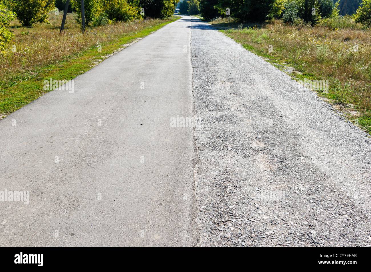 A road of local importance with two lanes of traffic, one half of which ...