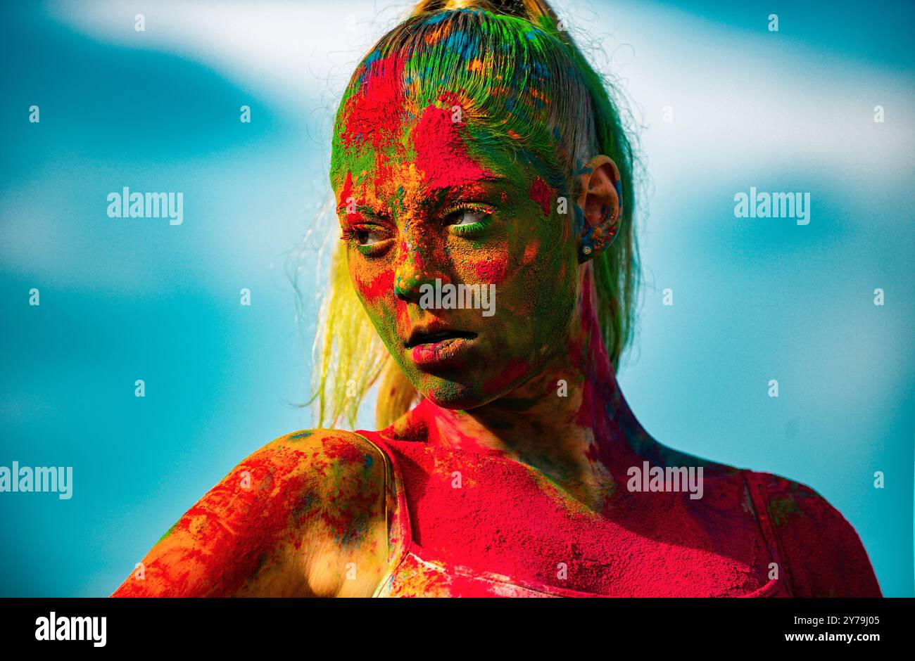 Color face with colorful holi splash Stock Photo - Alamy