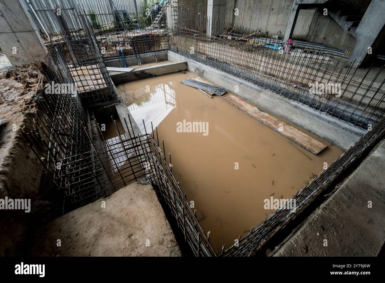 A construction site featuring a large puddle of standing water Stock ...