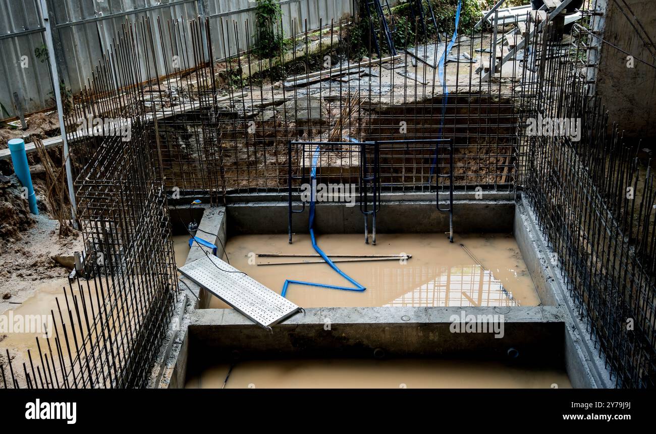 A construction site displaying a reinforced concrete foundation with ...
