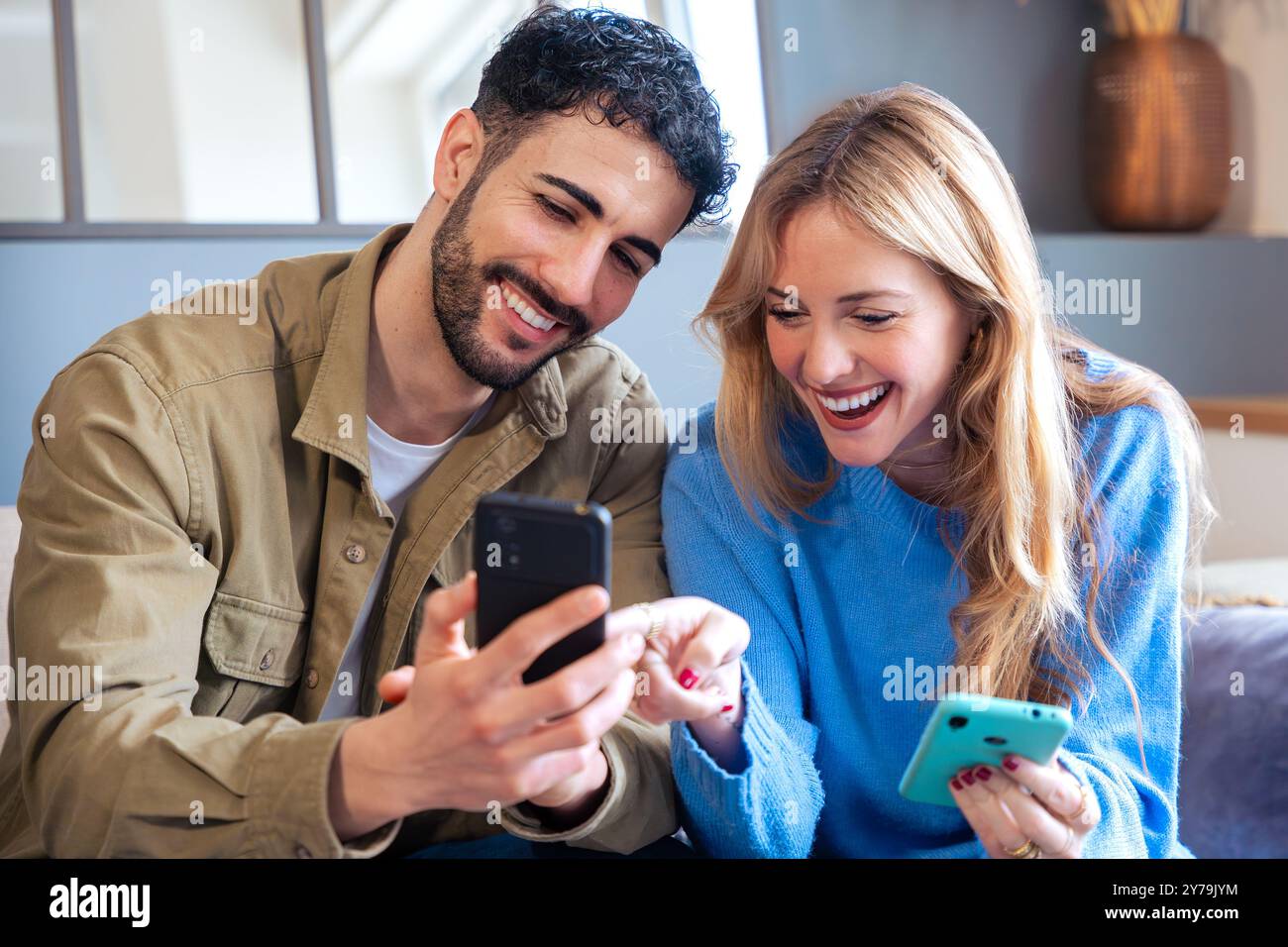 Couple excitedly sharing joyful hi-res stock photography and images - Alamy