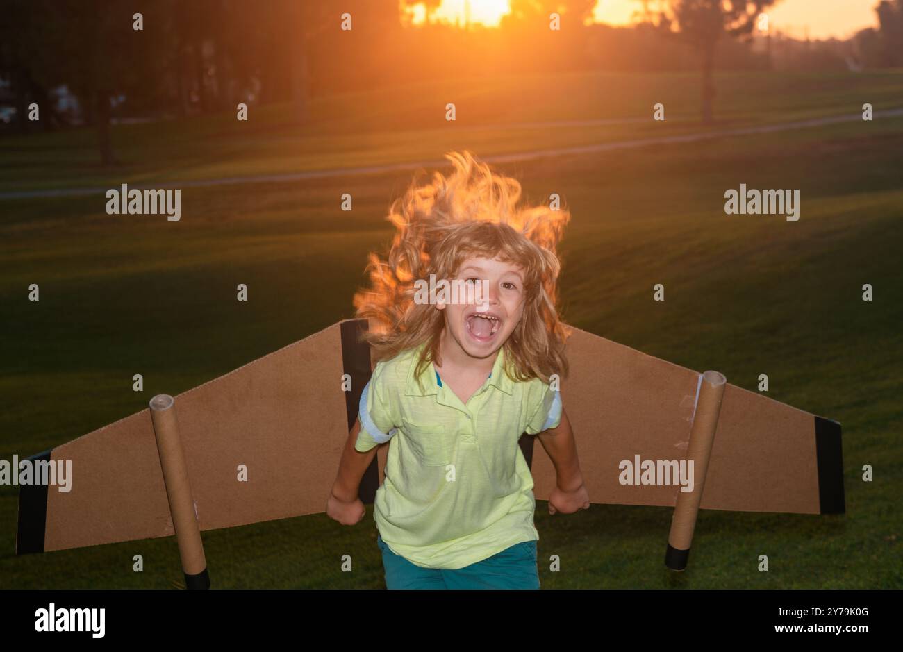 Excited child dreams of becoming a rocket pilot. Imagination and ...