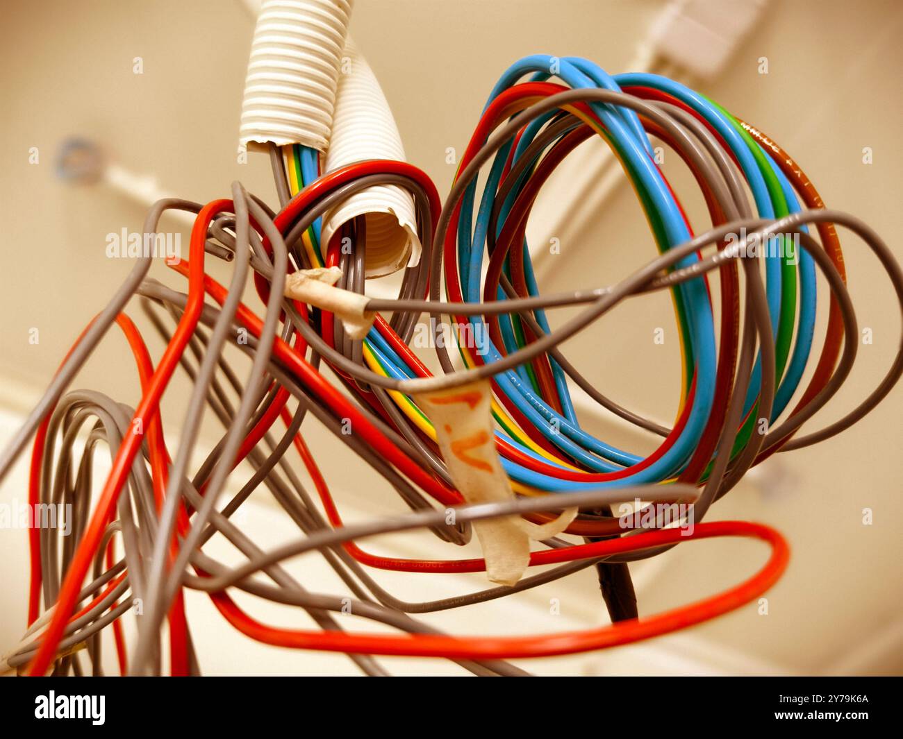 A collection of various wires is hanging down from the ceiling Stock ...