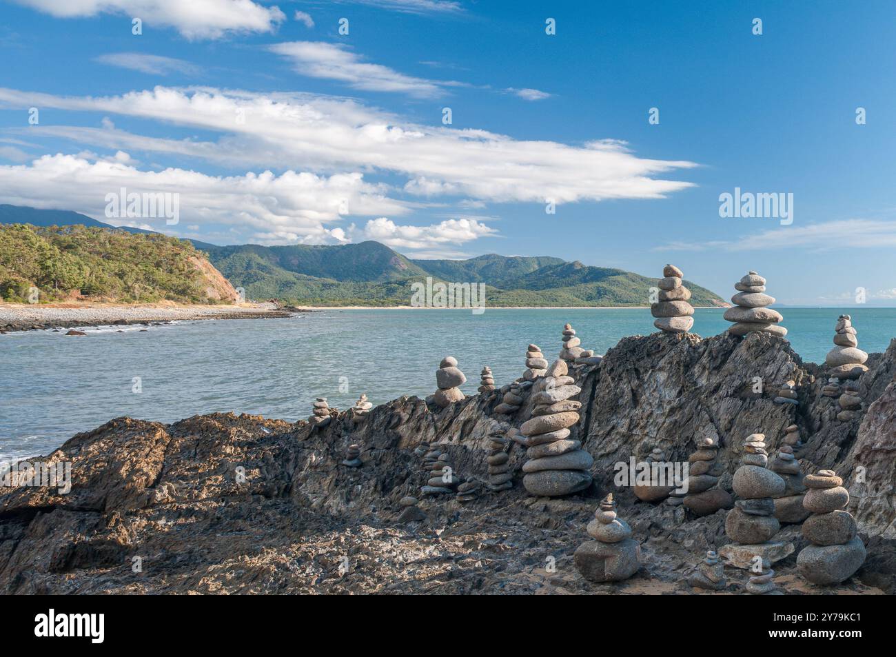 Ruggedly gorgeous, rocky coastline with rock cairns along the Highway ...