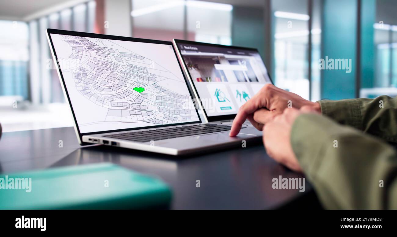 Developer Looking At Land Plot Map And Cadastre Plan Stock Photo - Alamy