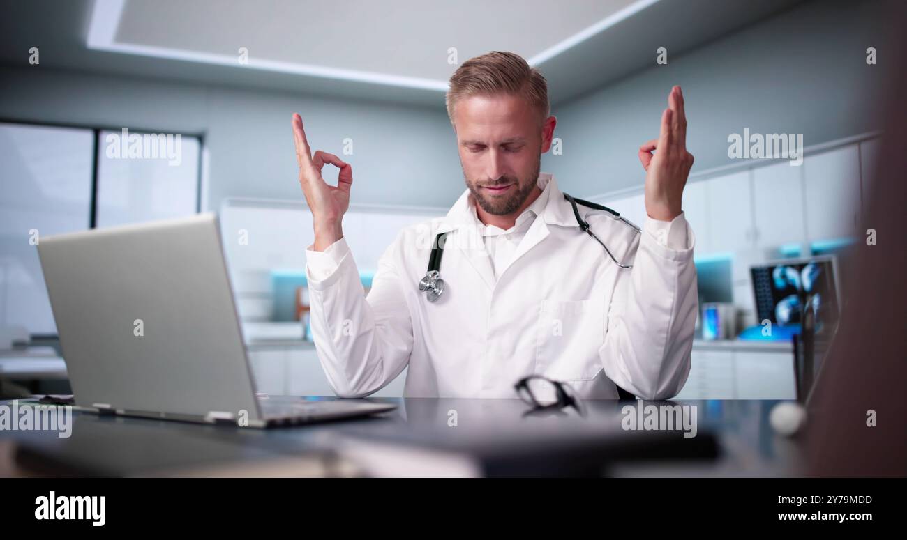 Medical Doctor Meditation In Office. Yoga At Workplace Stock Photo - Alamy